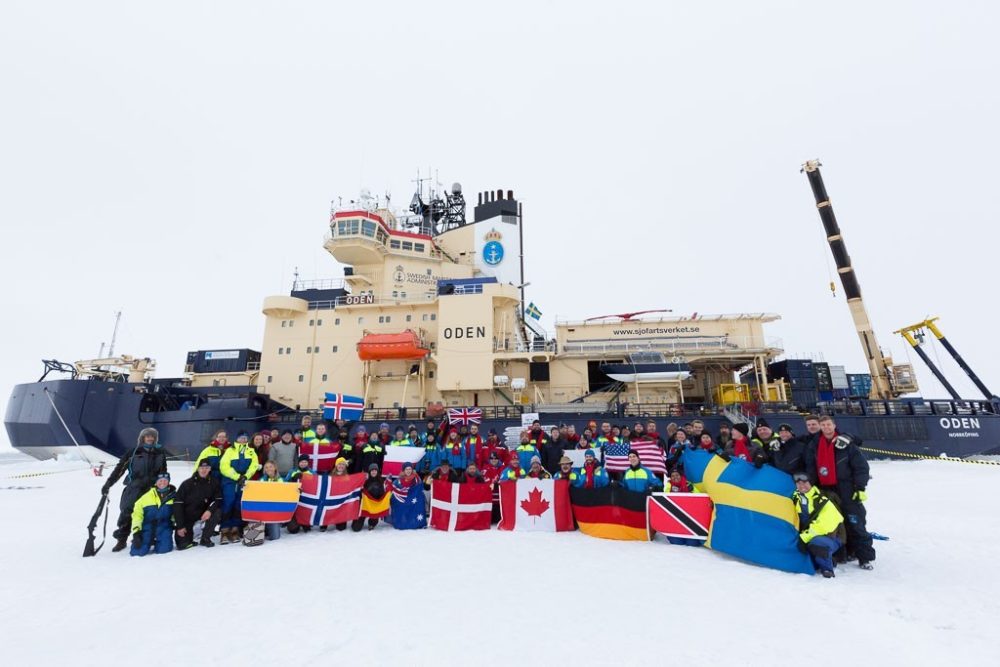 Three Arctic researchers at North Pole