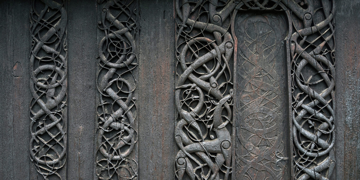 What do the animals in stave church ornamentation signify?